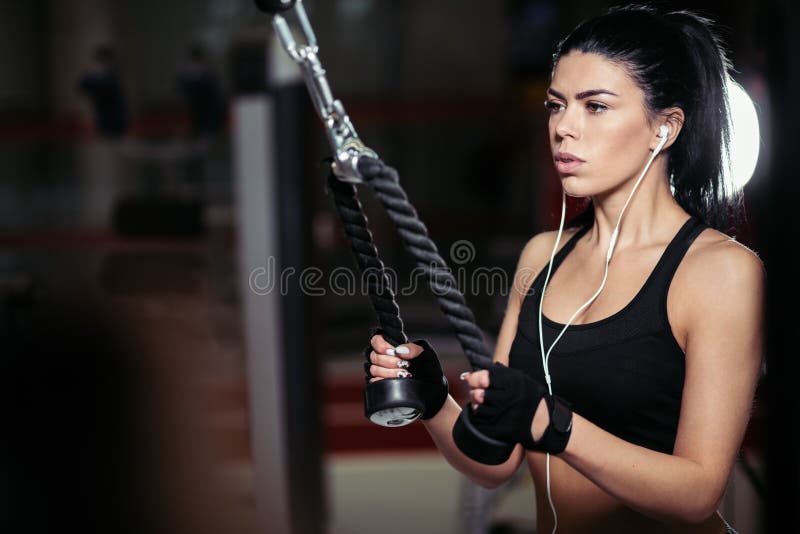 Woman Doing Exercise at Crossover Machine in Gym Stock Image - Image of ...