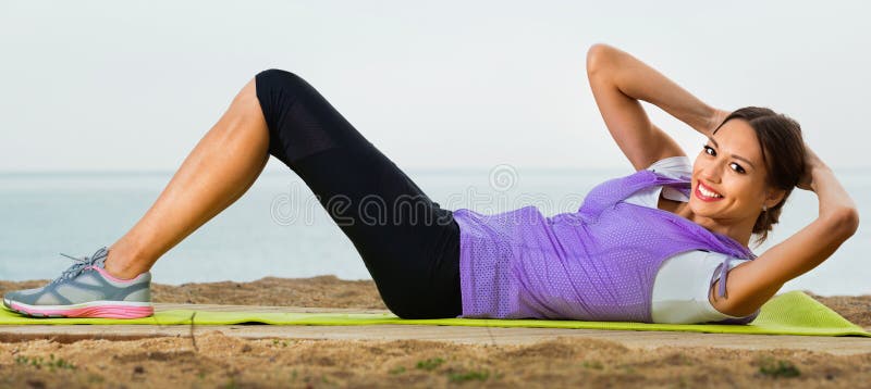 Woman Doing Exercises on Beach by Ocean Stock Image - Image of adult ...