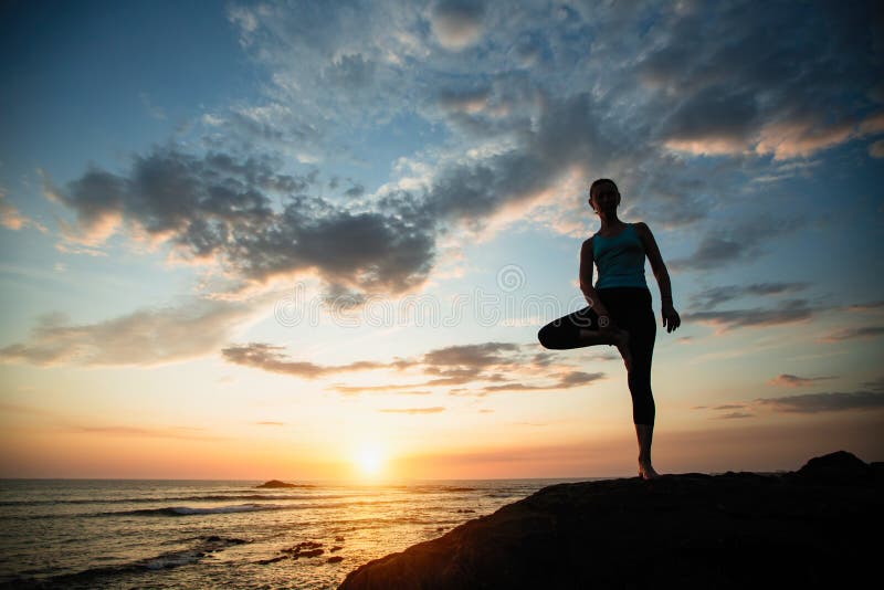 Woman Doing Exercises on the Ocean during Sunset Stock Photo - Image of ...