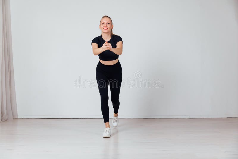 A Woman Doing Exercises in a Bright Room Exercises Warm-up Stock Photo ...