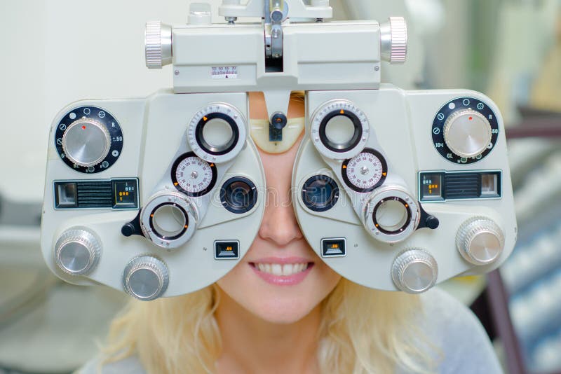 Woman doing eyes test stock image. Image of intraocular - 132202507