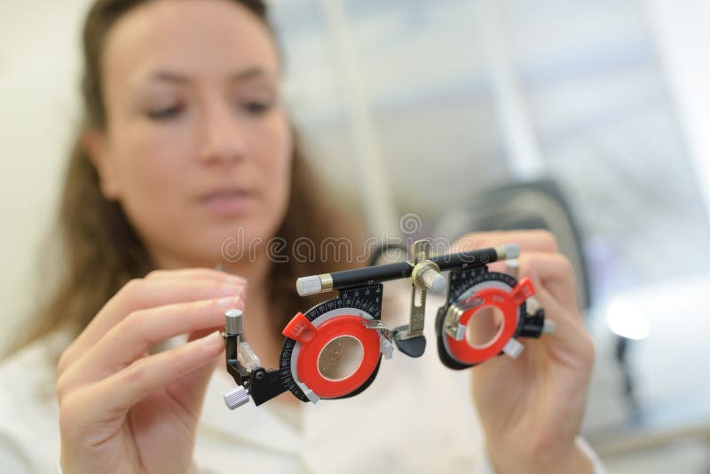 Woman doing eyesight test stock image. Image of asia - 322654453