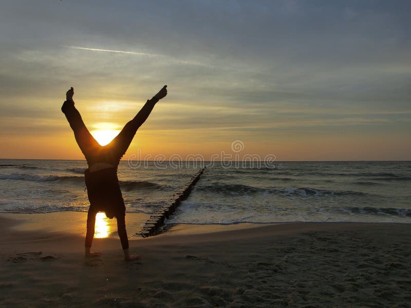 Woman Doing Handstand Beach Stock Photos - Download 150 Royalty Free Photos