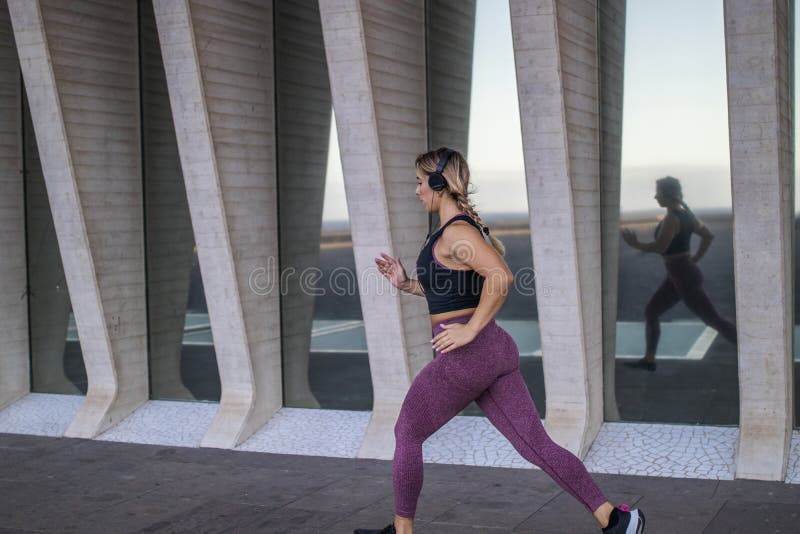 Woman Doing Jogging Reflected in the Mirror Stock Photo - Image of ...