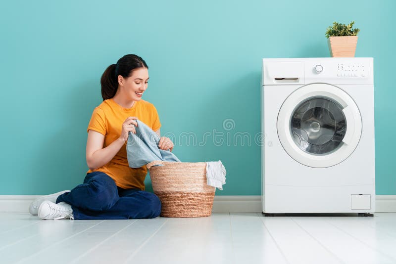 Woman doing laundry stock image. Image of casual, laundry - 207732493