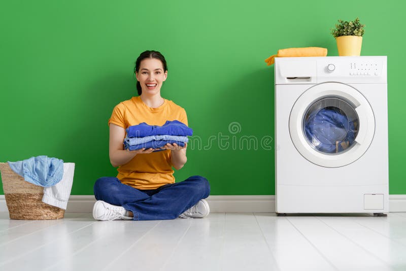 Woman doing laundry stock image. Image of care, cleaning - 213954429