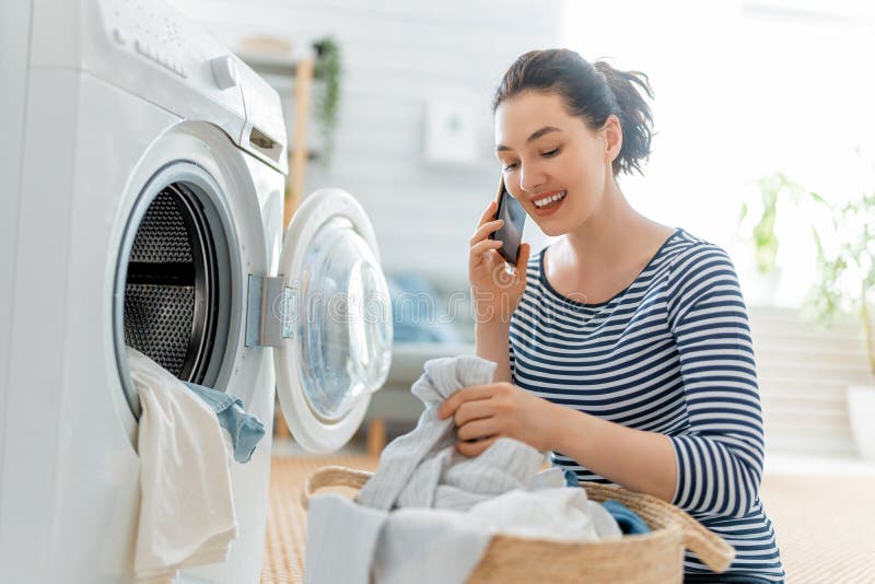 Woman is doing laundry stock image. Image of cleaning - 214554777