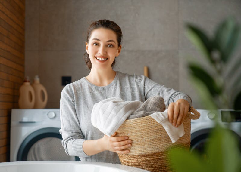 Woman is doing laundry stock photo. Image of domestic - 241410586