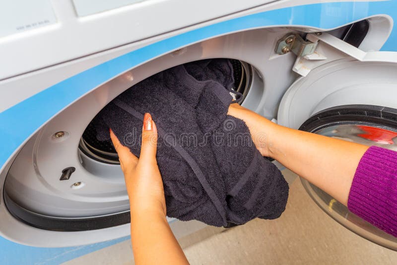 Woman doing laundry stock photo. Image of caucasian - 125110942