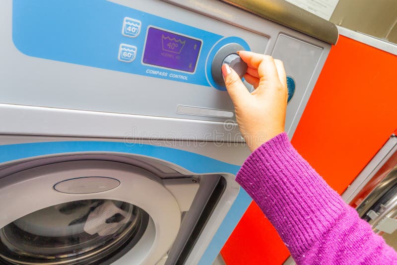 Woman doing laundry stock image. Image of indoor, housecleaning - 125110943