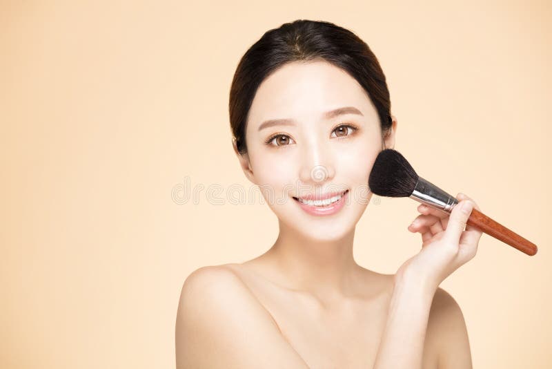 Woman Doing Make Up on Face with Cosmetic Brush Stock Image - Image of ...