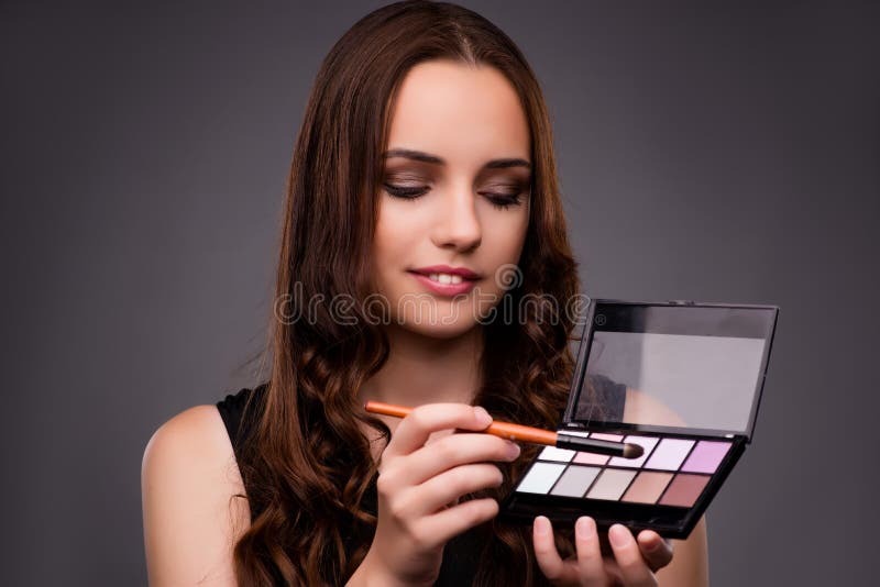 The Woman Doing Makeup on Dark Background Stock Photo - Image of ...
