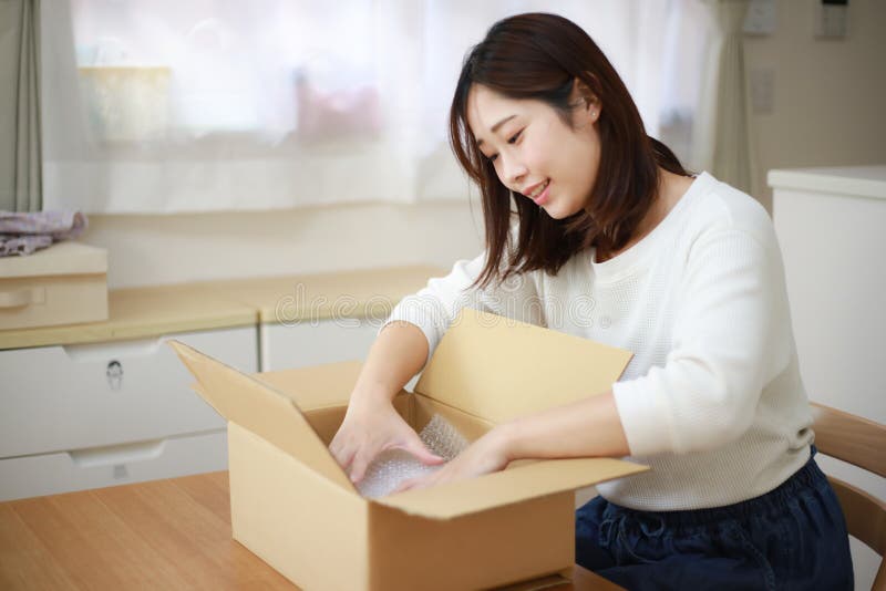 Woman doing packing work stock photo. Image of detached - 244452838