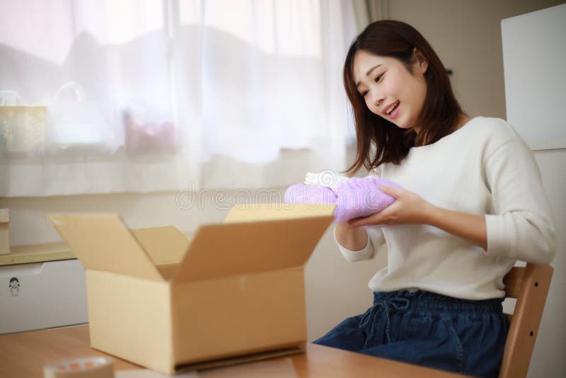 Woman doing packing work stock image. Image of flima - 244452845