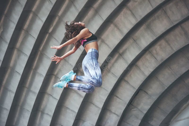 Woman Doing Parkour in the City on a Sunny Day. Stock Image - Image of ...