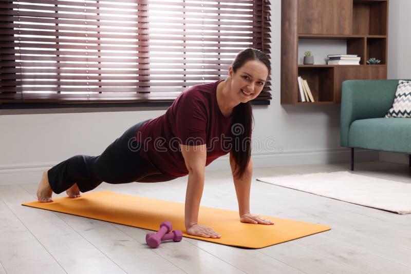 Overweight Woman Doing Plank Exercise at Home Stock Photo - Image of ...