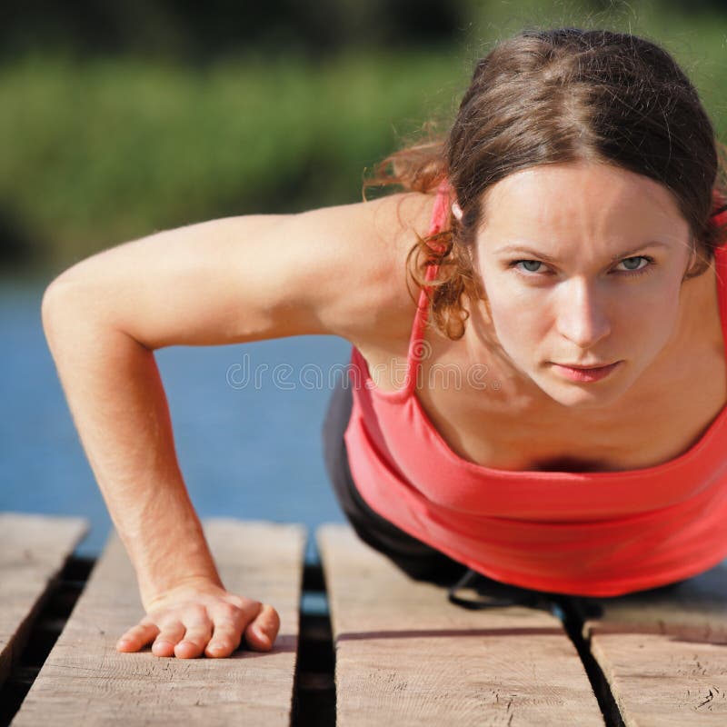 Woman doing push-ups stock photo. Image of bridge, girl - 19133588