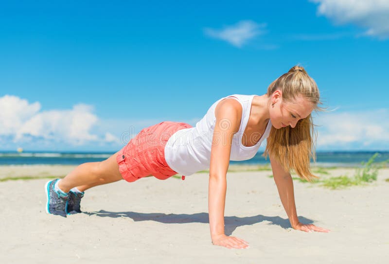 Woman doing push-ups. stock photo. Image of healthy, intense - 43611108