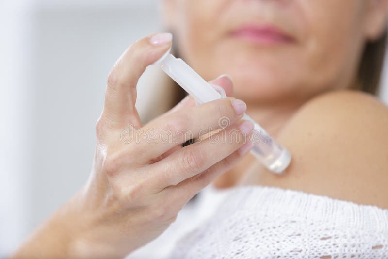 Woman doing self injection stock photo. Image of receiving - 221049886