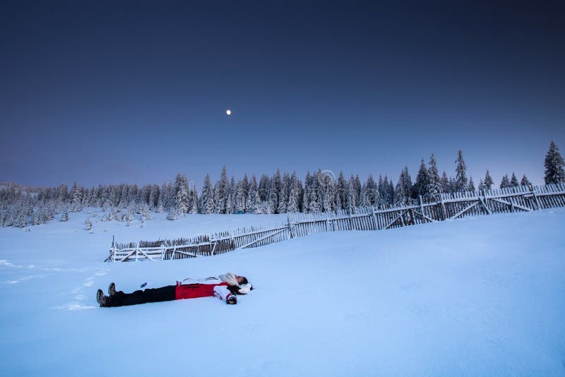 Woman Doing a Snow Angel in Heavy Snow. Winter Time Stock Photo - Image ...