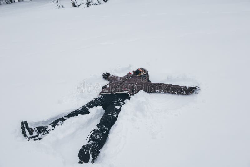 Woman Doing a Snow Angel in Heavy Snow. Winter Time Editorial Image ...