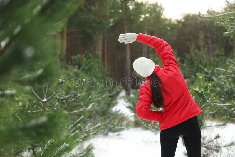 Woman Doing Sports Exercises in Winter Forest, Back View Stock Photo ...