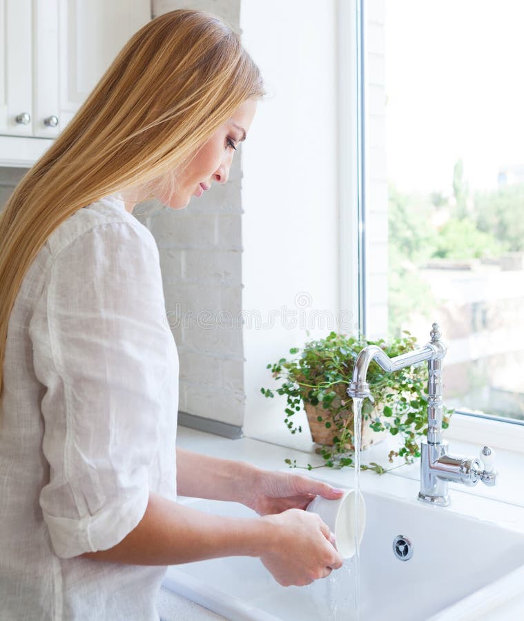 Woman doing the washing up stock photo. Image of female - 43558494