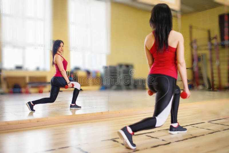 Woman Doing a Workout with Dumbbells at the Gym Stock Photo - Image of ...
