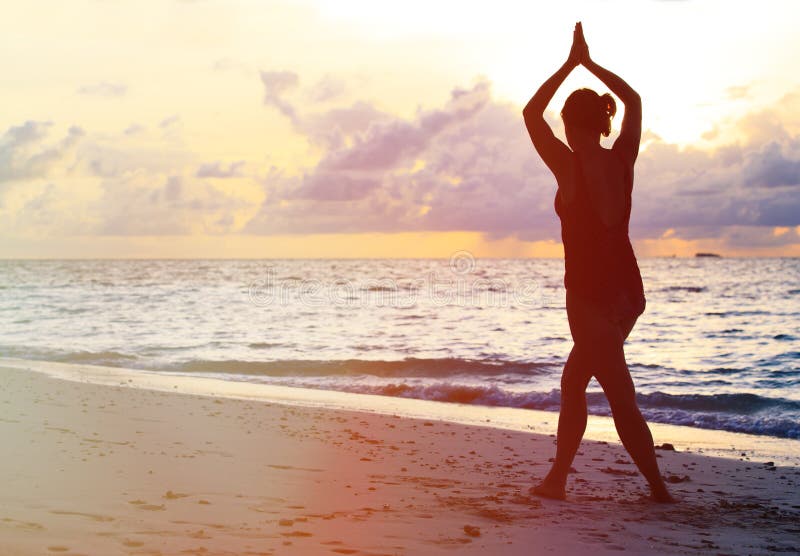 Woman Doing Yoga on Sunset Beach Stock Image - Image of contemplation ...