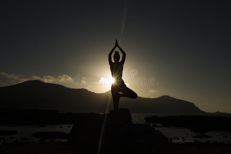 Woman Doing Yoga in the Sunset Stock Photo - Image of nature, people ...