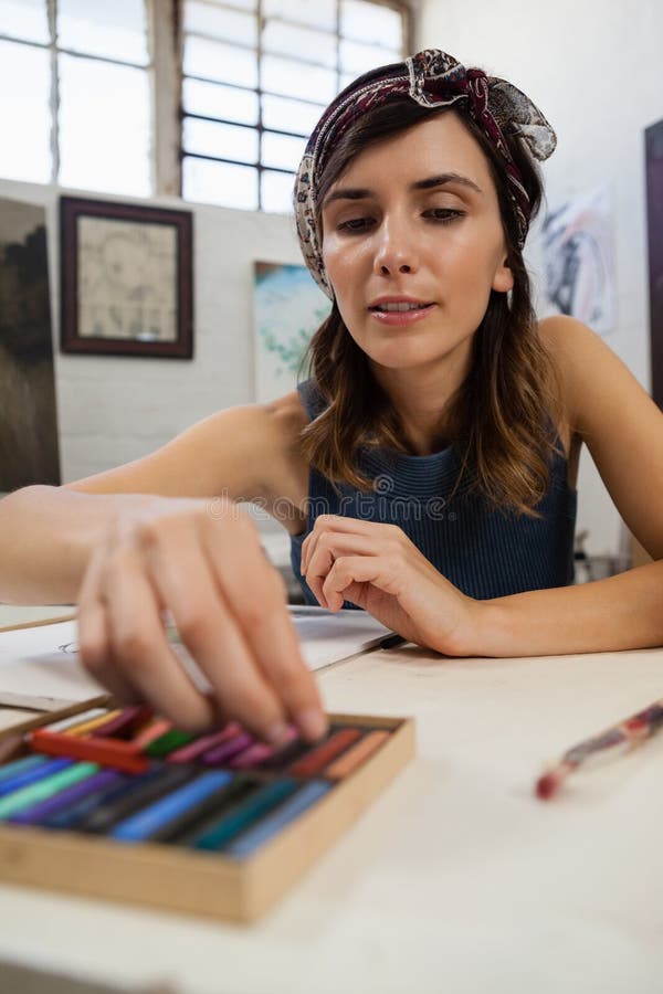 Woman Drawing on Book in Drawing Class Stock Photo - Image of apron ...