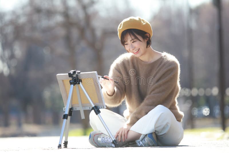 Woman drawing a picture stock image. Image of drawing - 241792721