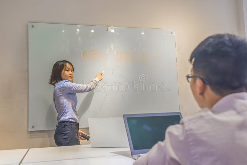 Woman Drawing on White Board during Presentation in Conference Room ...