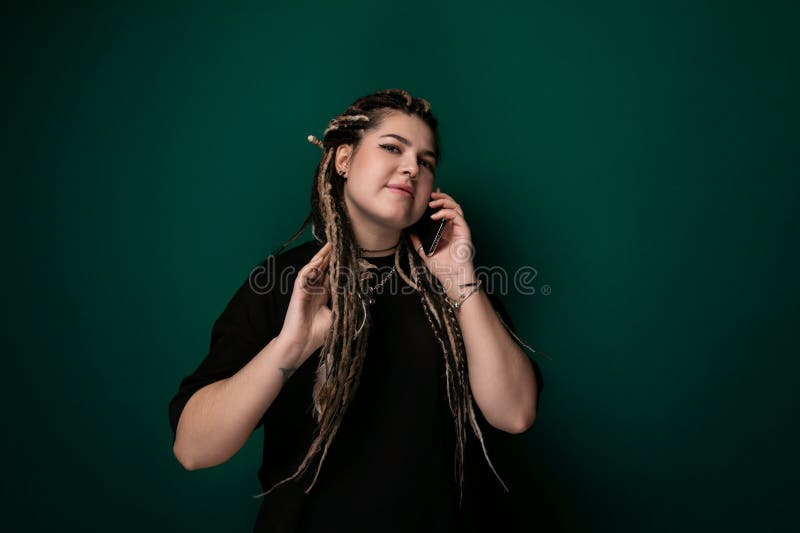 Woman with Dreadlocks Talking on a Cell Phone Stock Photo - Image of ...
