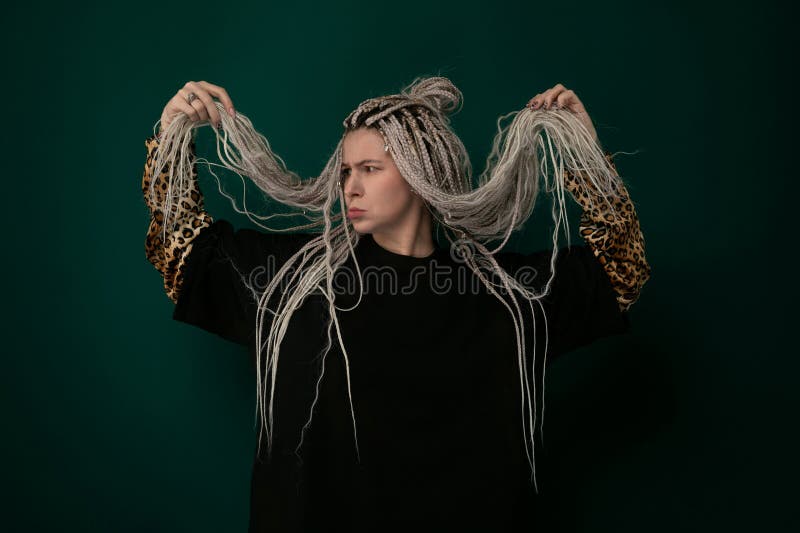 Woman with Dreadlocks Standing in Front of Green Background Stock Image ...