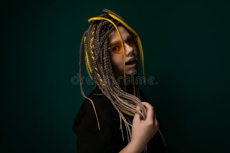 Woman with Dreadlocks Standing in Front of Green Background Stock Image ...