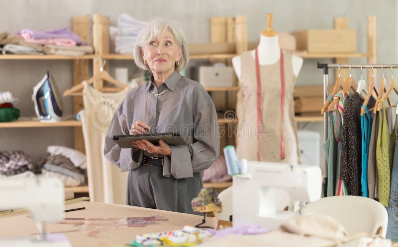 Woman Dressmaker Makes Pattern Using Tablet Stock Photo - Image of ...