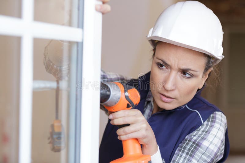 Woman Drilling Window Frame Stock Image - Image of power, holding ...