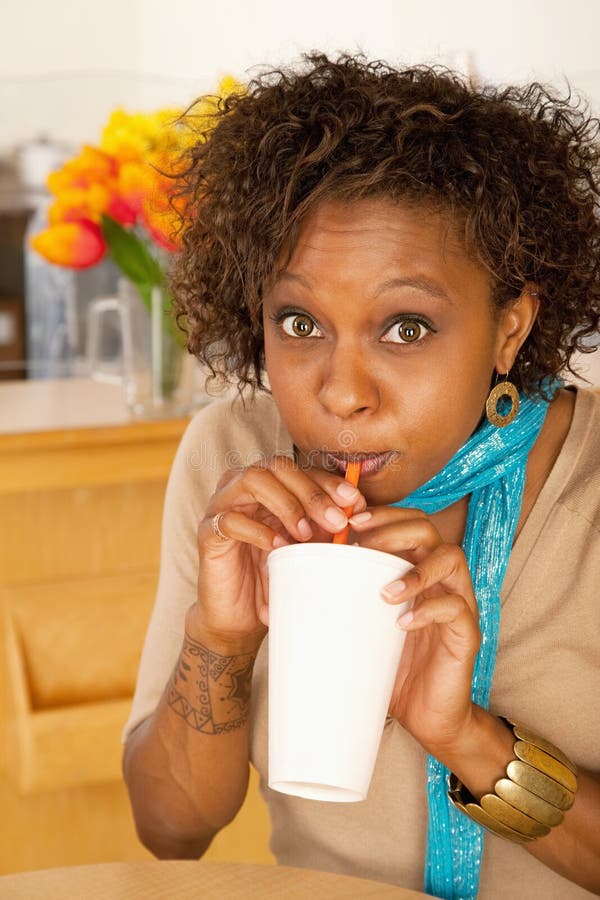 Woman Drinking Beverage stock image. Image of looking - 14793493
