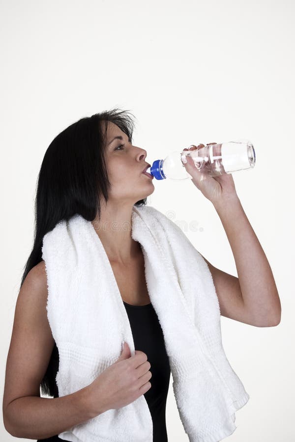 Woman Drinking Bottled Water Stock Image - Image of brunette, lifestyle ...