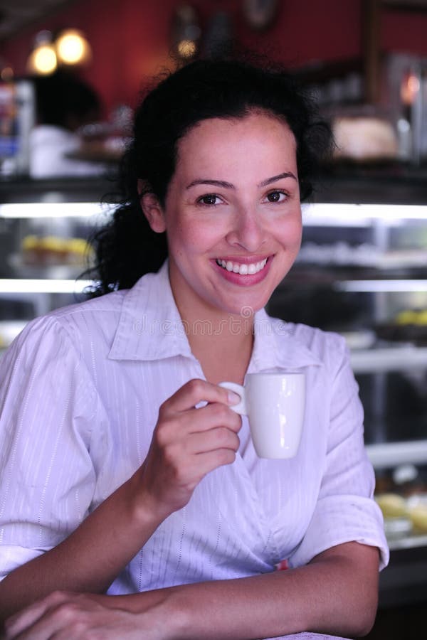 Woman drinking a coffee stock image. Image of daytime - 12825843