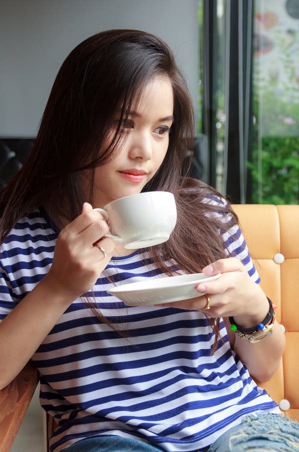Beautiful Girl Drinking Hot Coffee or Tea in Coffee Cafe Stock Photo - Image of beverage, cafe ...