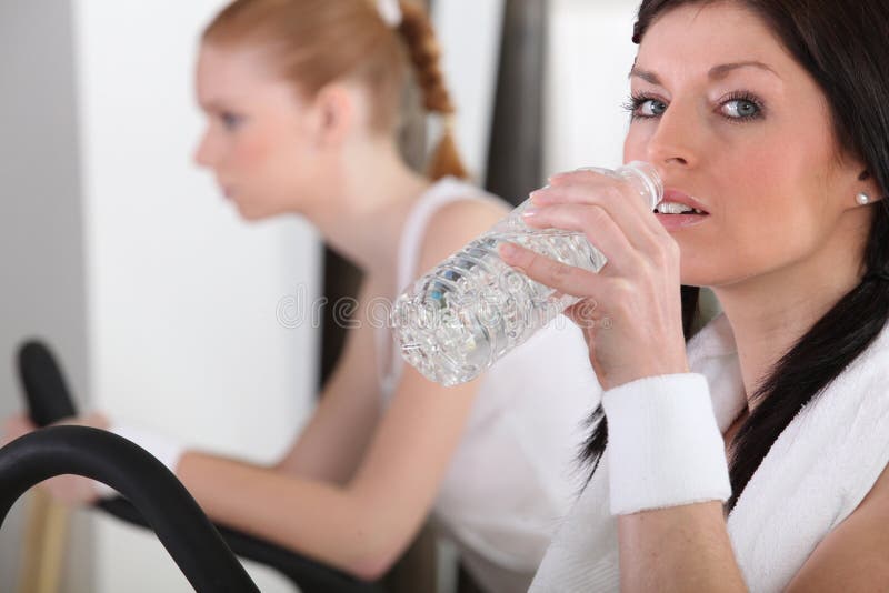 Woman Drinking after Exercise Stock Photo - Image of plastic ...