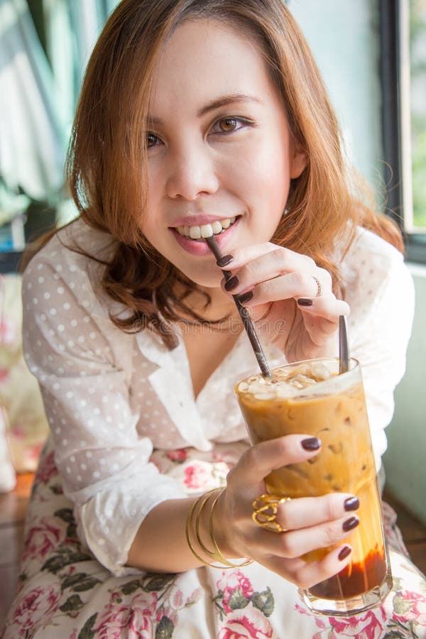 Woman Drinking Iced Coffee. Stock Image - Image of girl, milk: 34312107