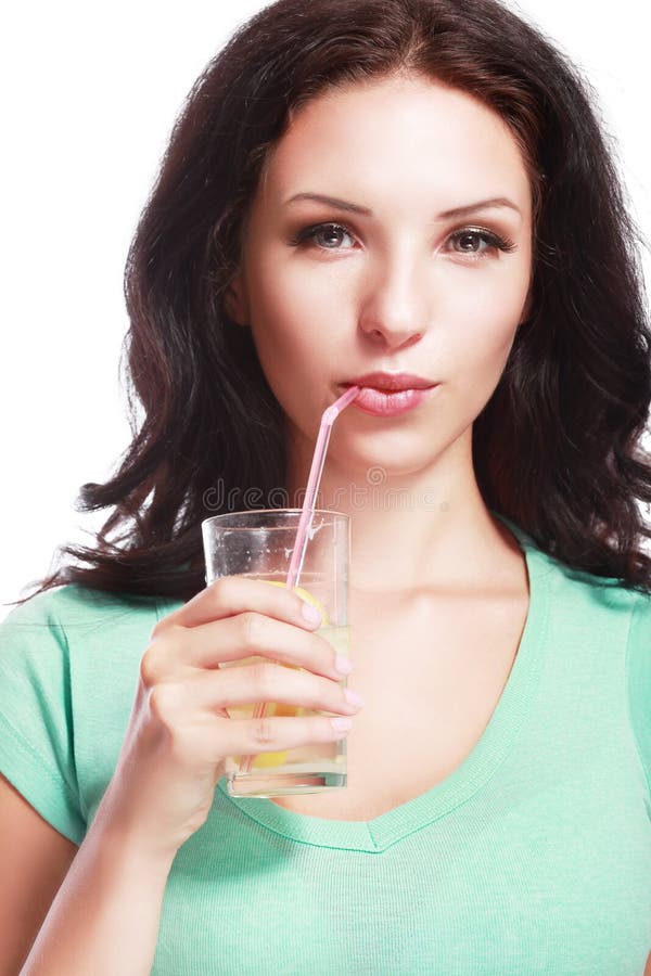 Young Woman Preparing and Drinking Lemonade in Her Kitchen Stock Photo ...