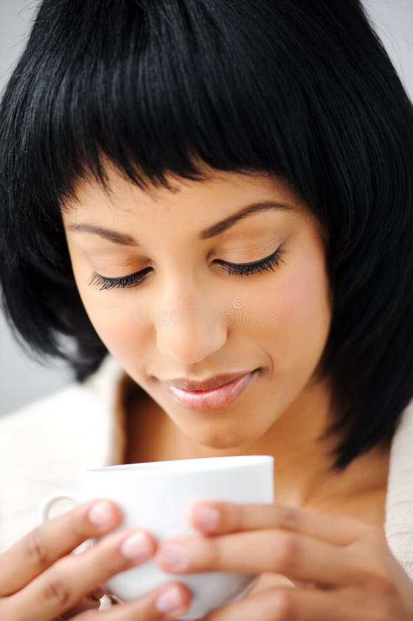 Woman drinking tea stock image. Image of sitting, adult - 21548389