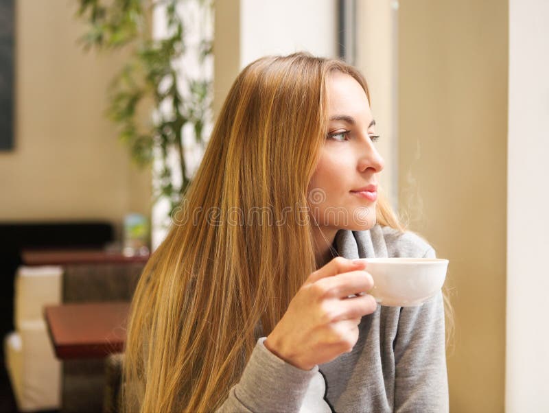 Woman drinking tea in cafe stock image. Image of cafe - 37910957