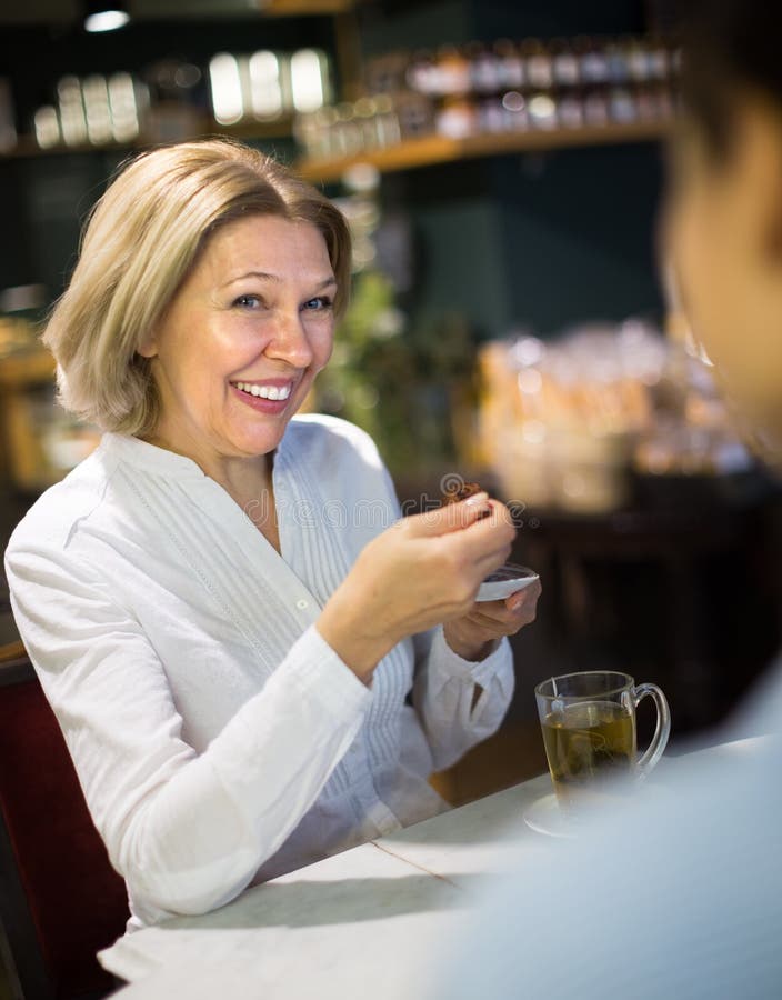 Woman Drinking Tea and Talking in Coffee-house Stock Photo - Image of ...