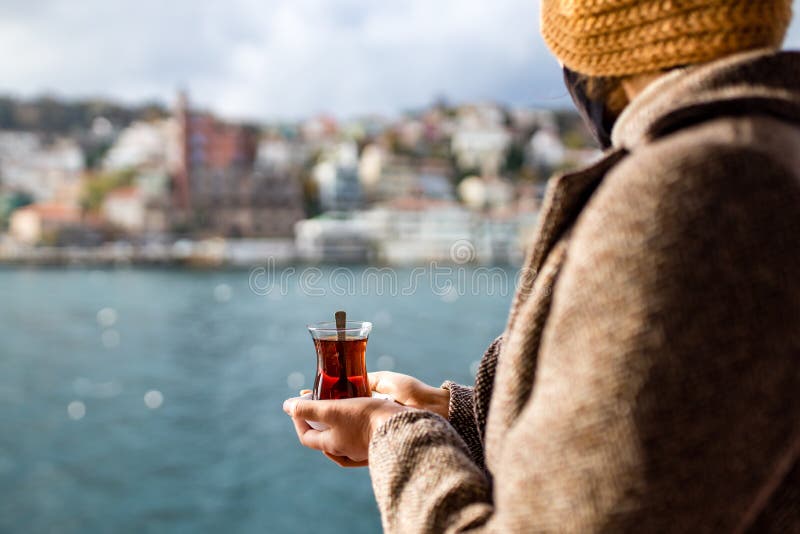 Woman Drinking Turkish Tea in the Front, Bosphorus Bay in the ...