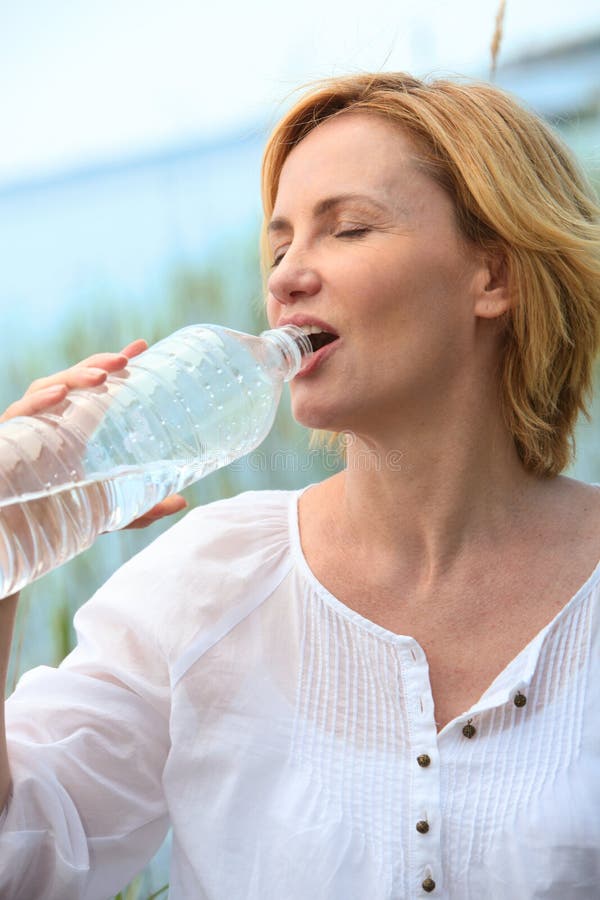 Woman drinking water stock image. Image of discipline - 20430379